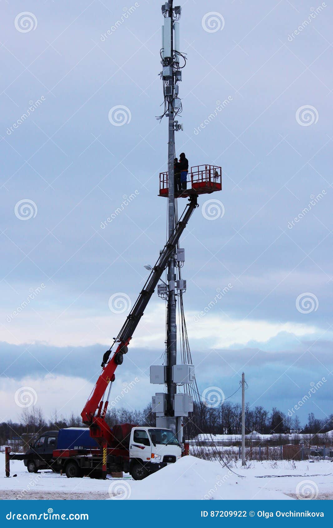 Two Workers Assemble Equipment for Telecommunications on the Tower with ...
