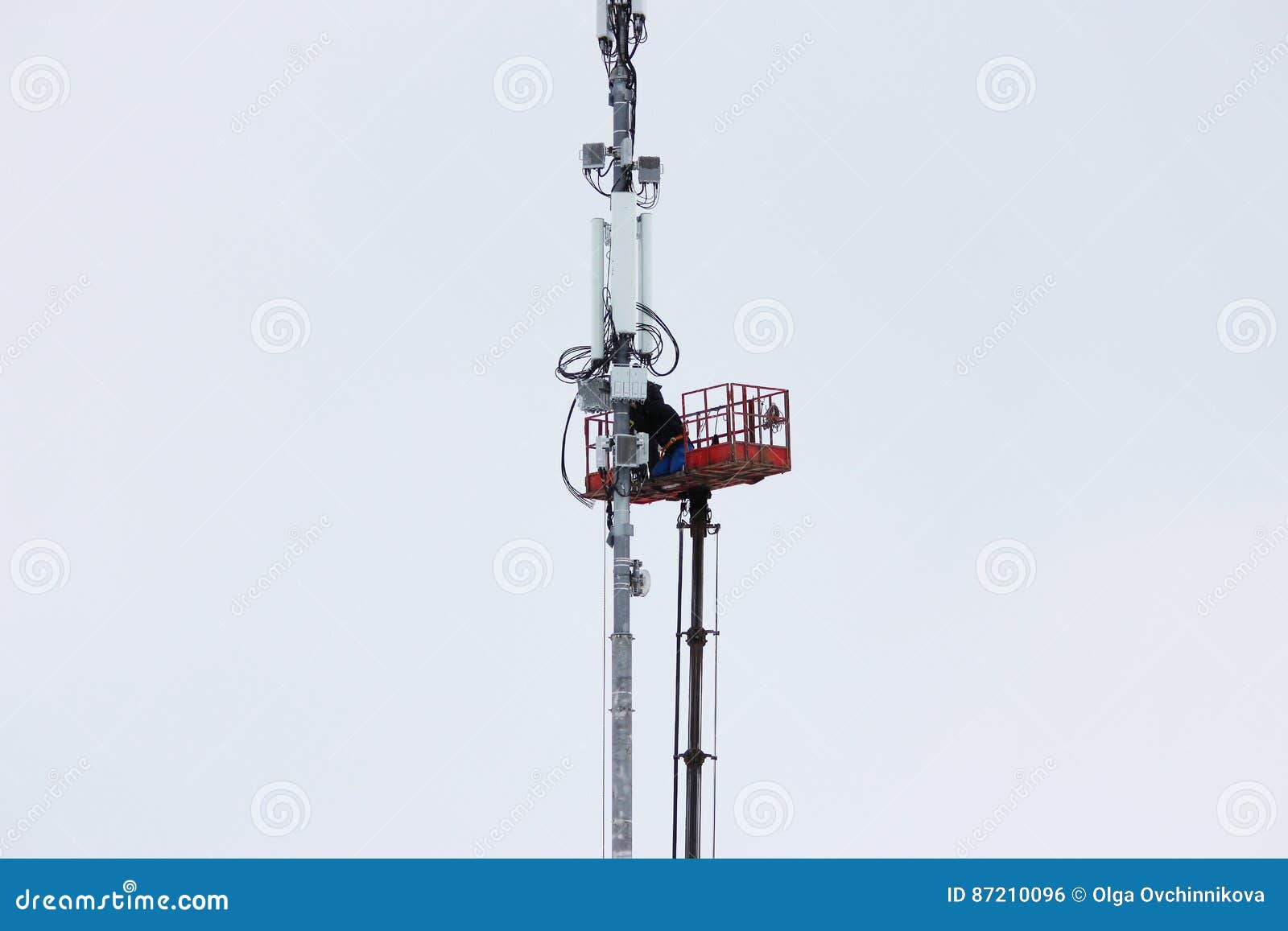 Two Workers Assemble Equipment for Telecommunications on the Tower with ...