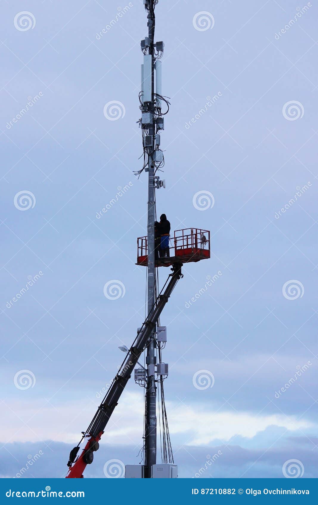 Two Workers Assemble Equipment for Telecommunications on the Tower with ...