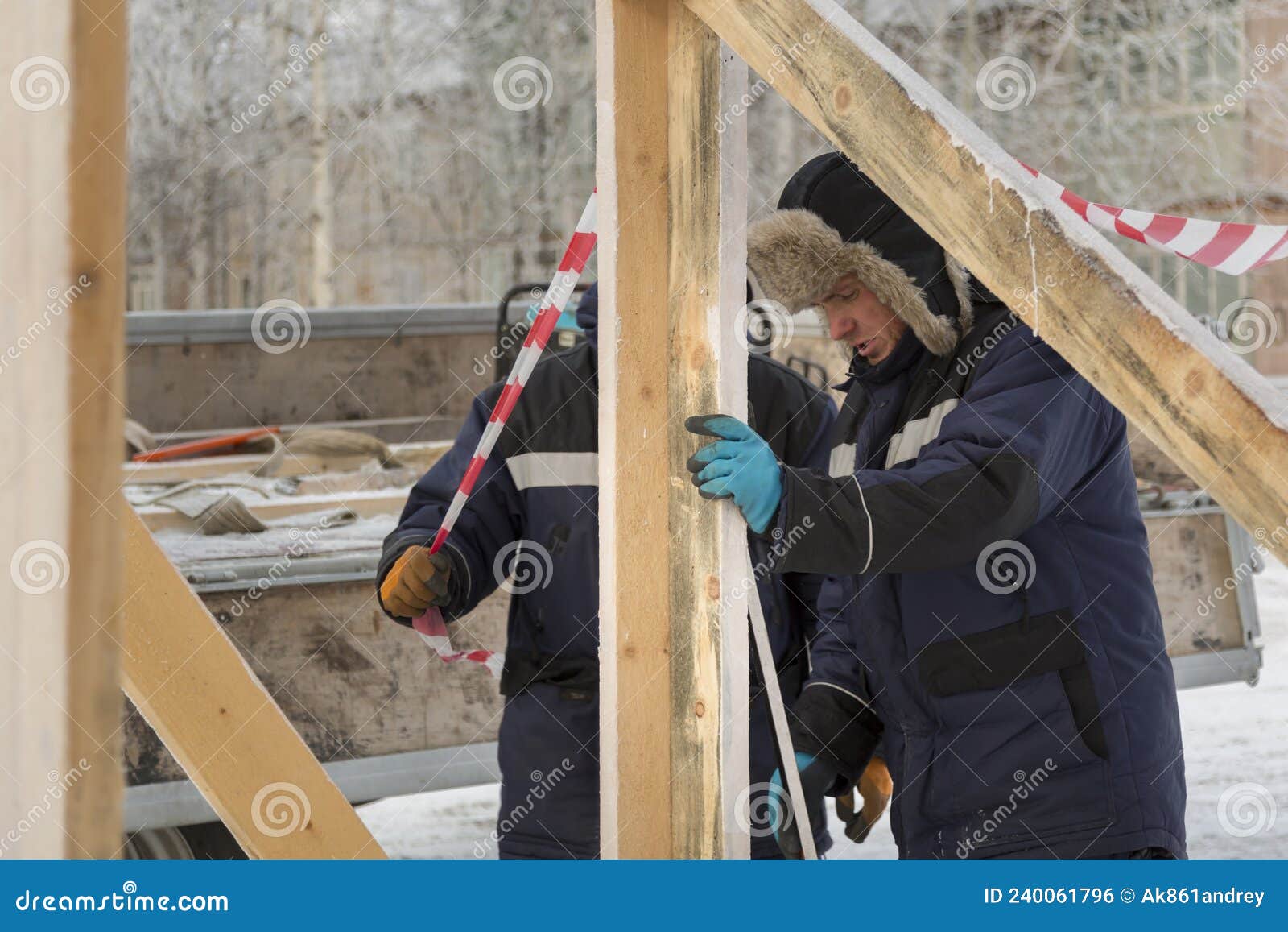 Workers Assembling the Frame of a Wooden Slide Stock Photo - Image of ...