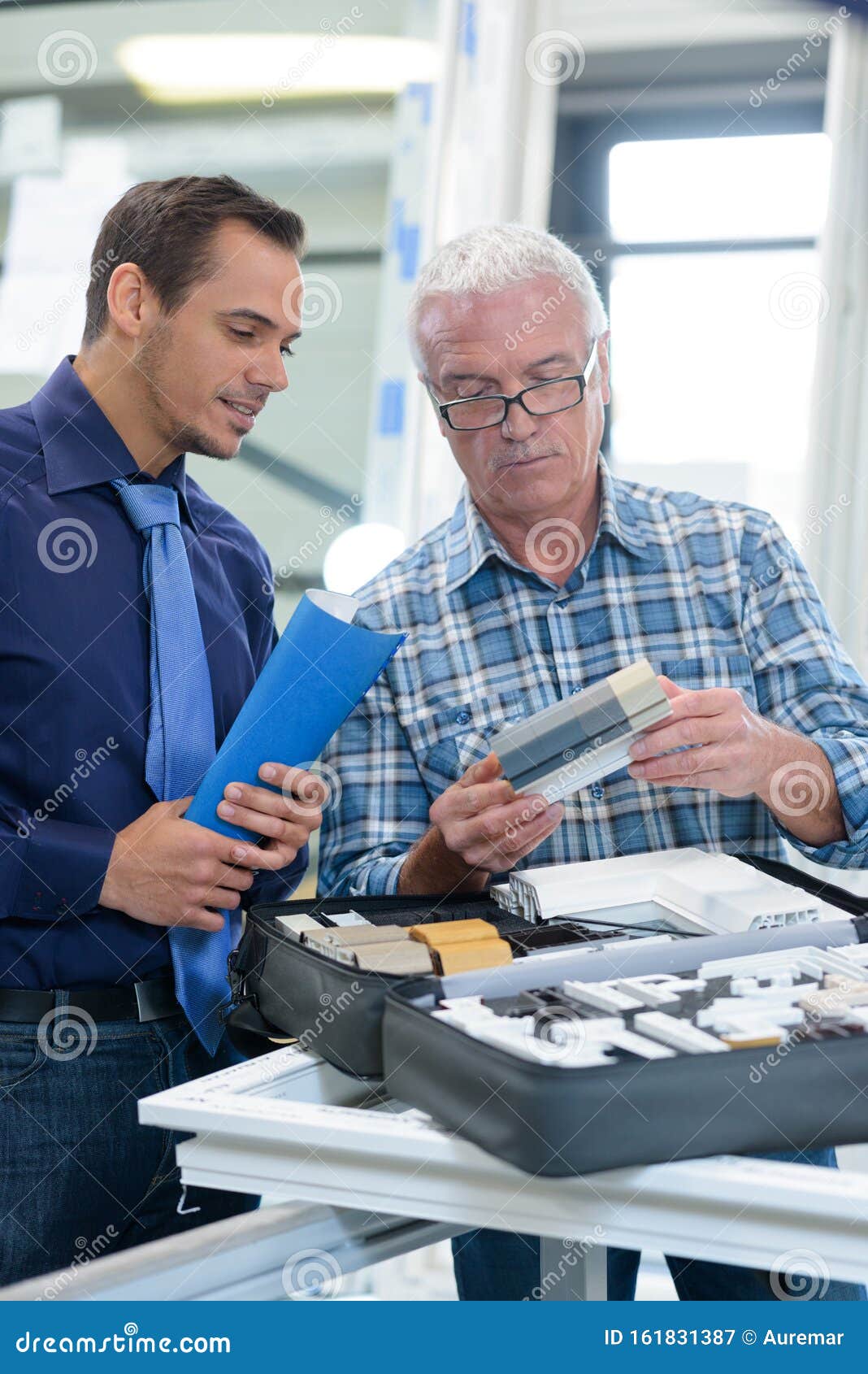 Two Workers Checking Something from Toolbox Stock Image - Image of ...