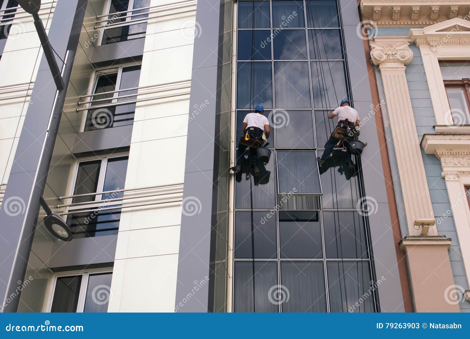Two Workers Cleaning Windows on High Rise Building Stock Image - Image ...
