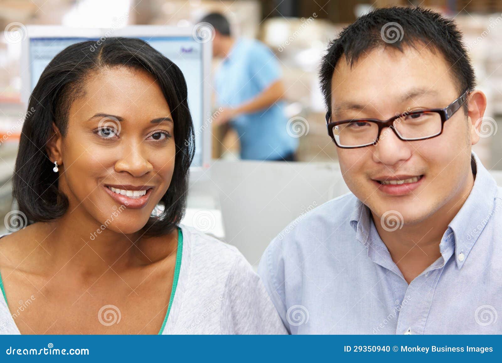 Two Workers at Computer Terminal in Distribution Warehouse Stock Photo ...