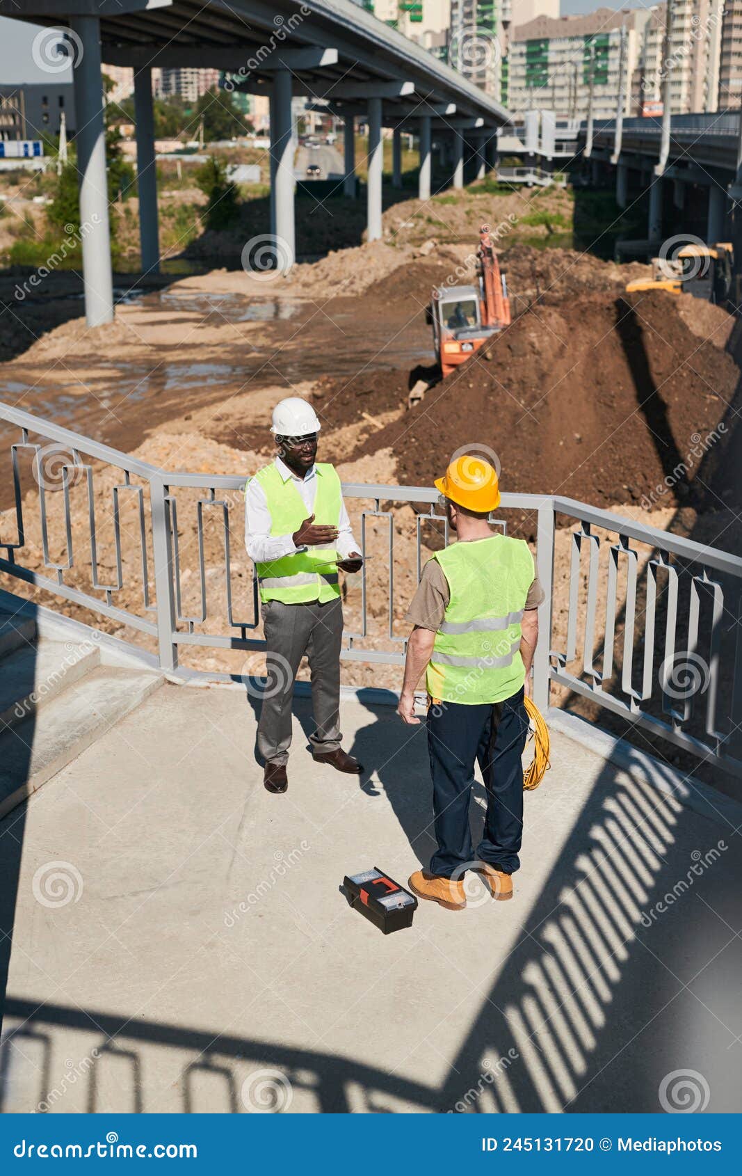 Two Workers at Construction Site Stock Photo - Image of adult, standing ...