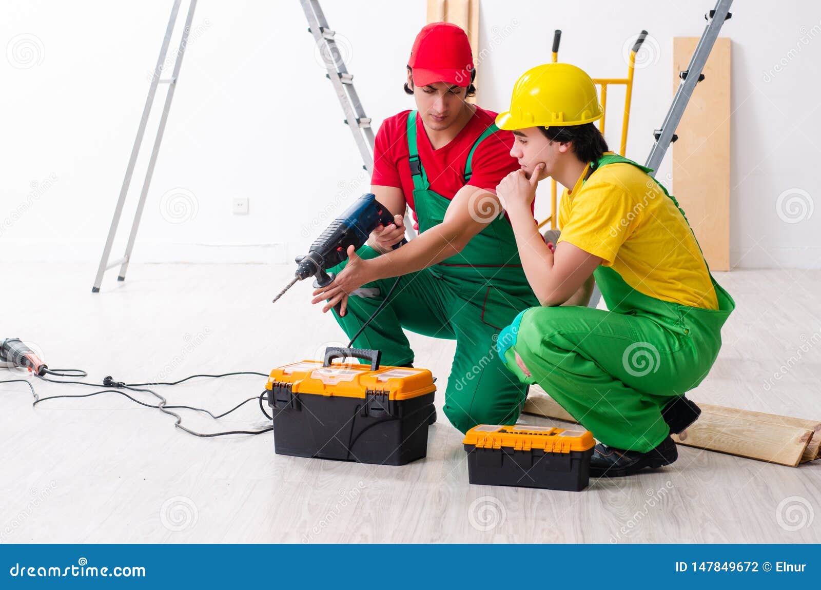 The Two Workers Contractors Working Indoors Stock Photo - Image of ...