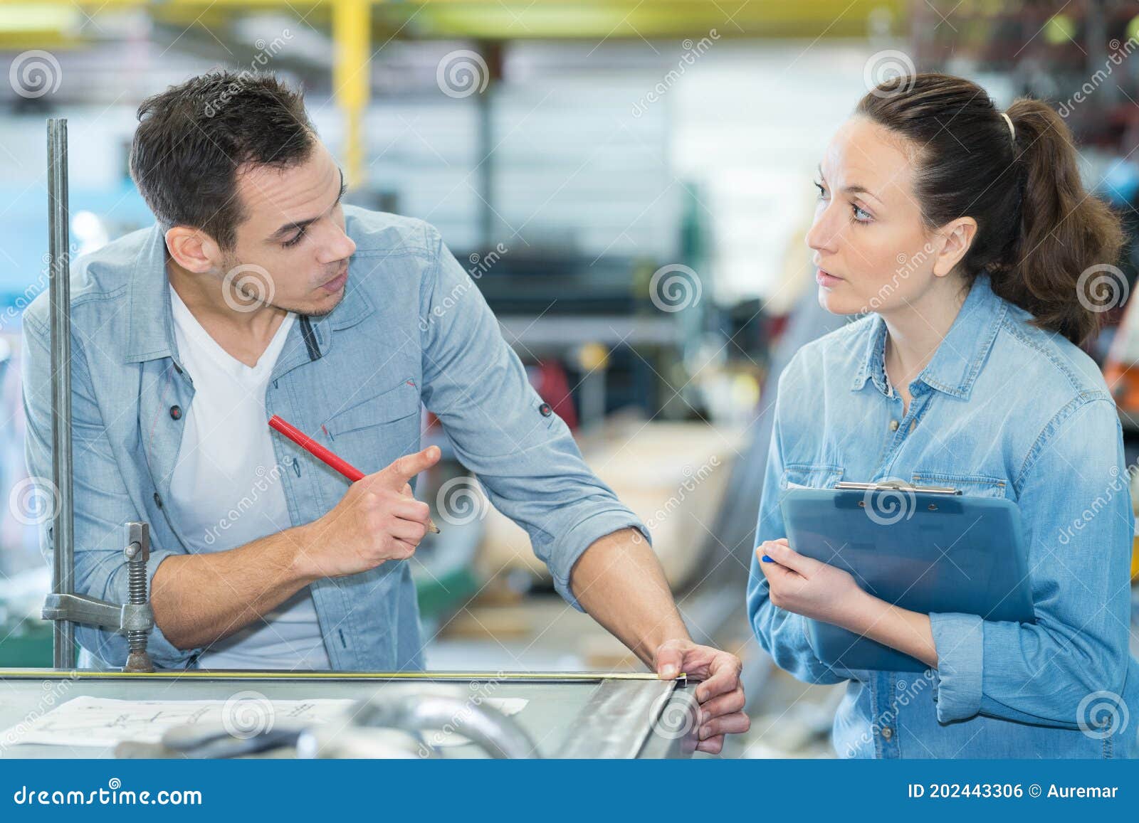 Two Workers Discussing Project in Factory Stock Photo - Image of ...