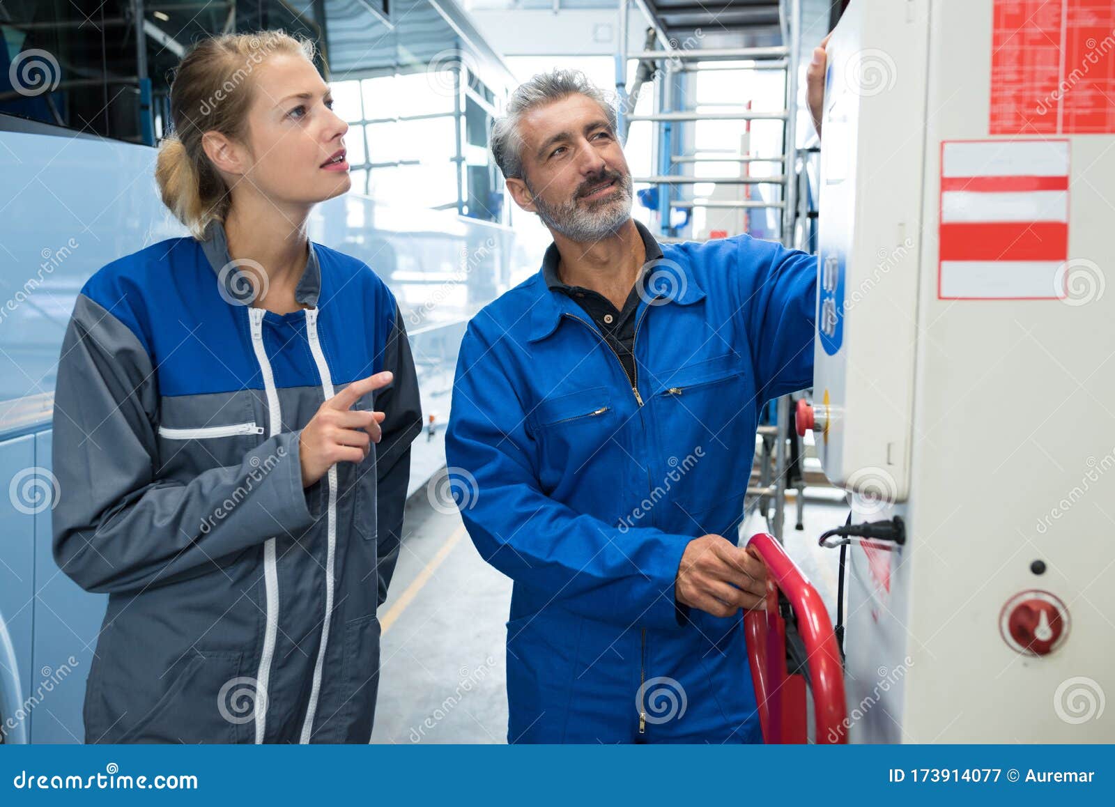Two Workers Doing Maintenance on Machine Stock Image - Image of ...