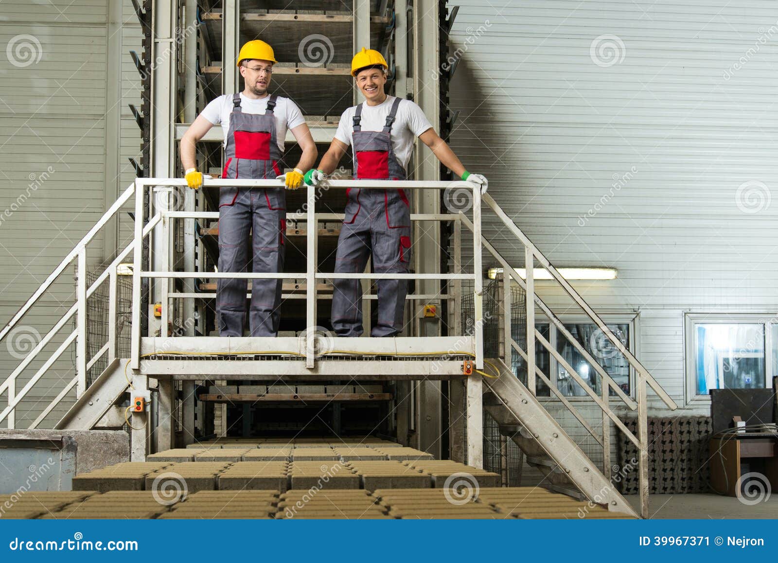 Two workers on a factory stock image. Image of assembly - 39967371