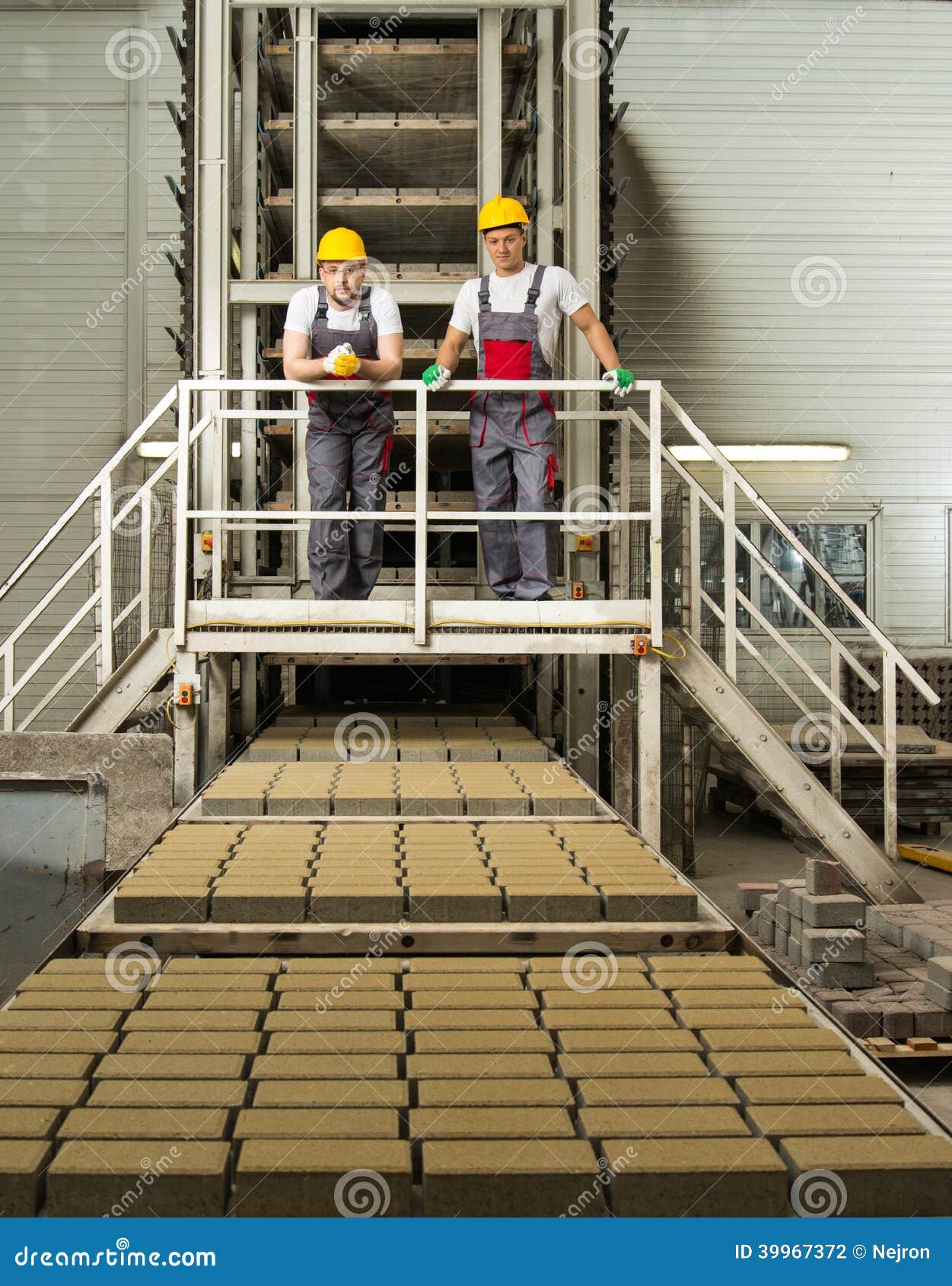 Two workers on a factory stock photo. Image of brick - 39967372