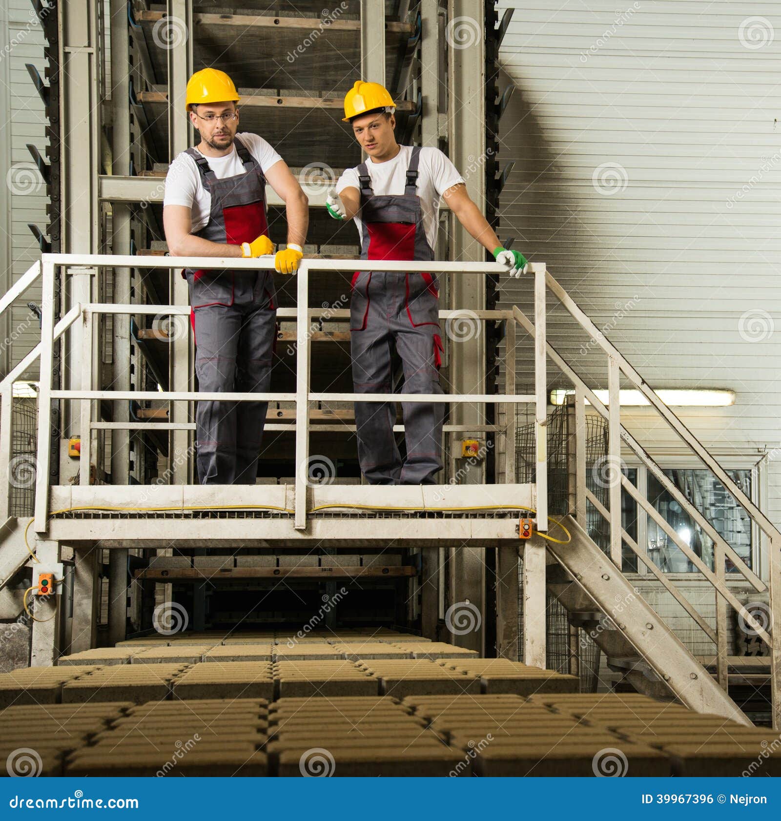 Two workers on a factory stock photo. Image of kerbstone - 39967396