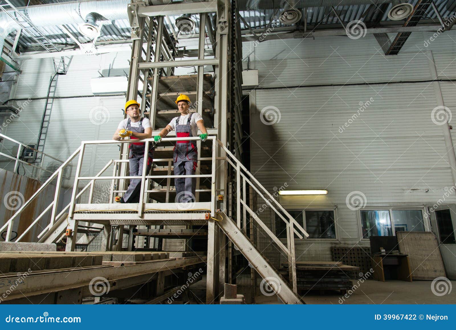 Two workers on a factory stock photo. Image of equipment - 39967422