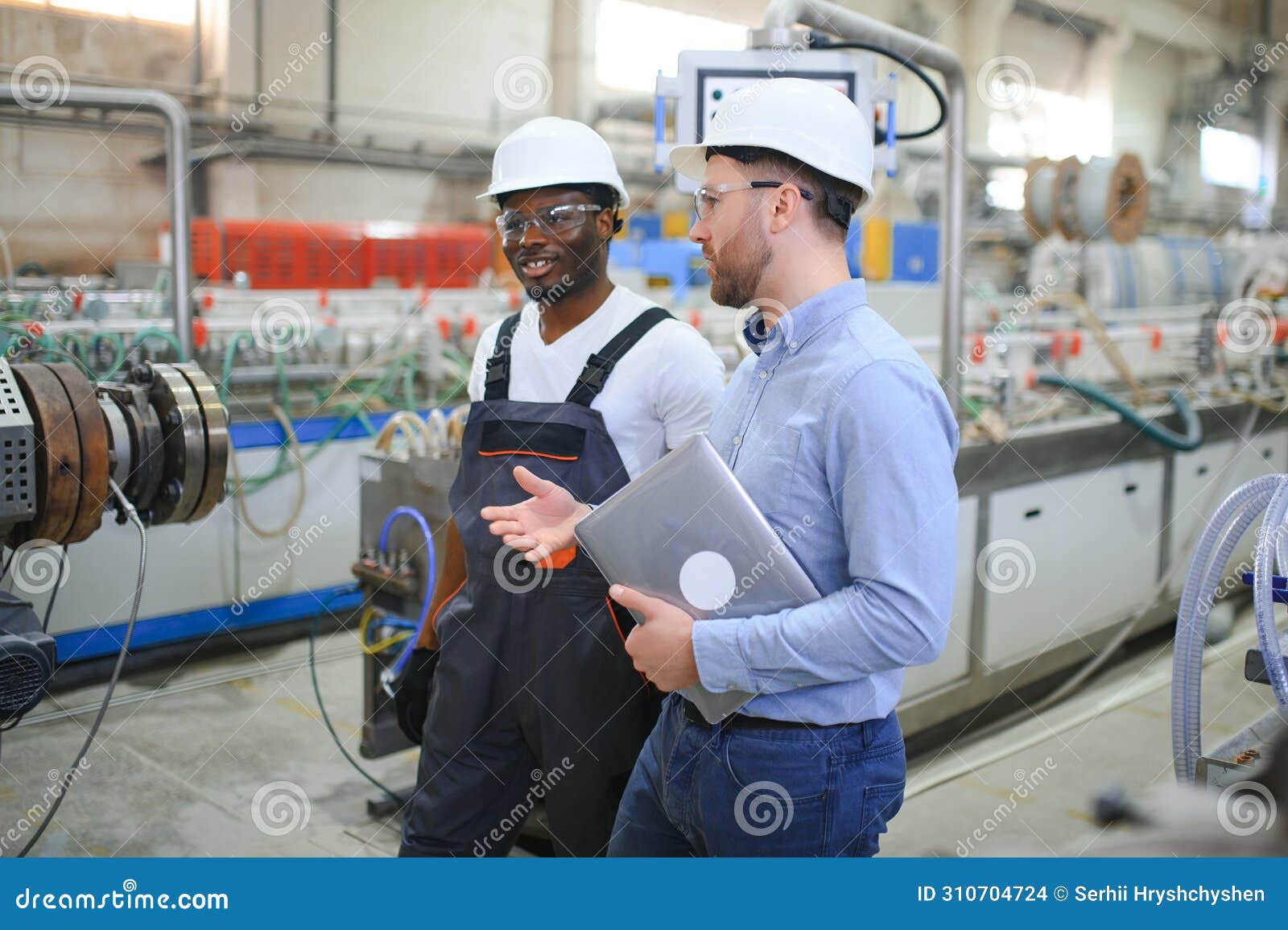 Two Workers at a Factory for the Production of Plastic Windows ...