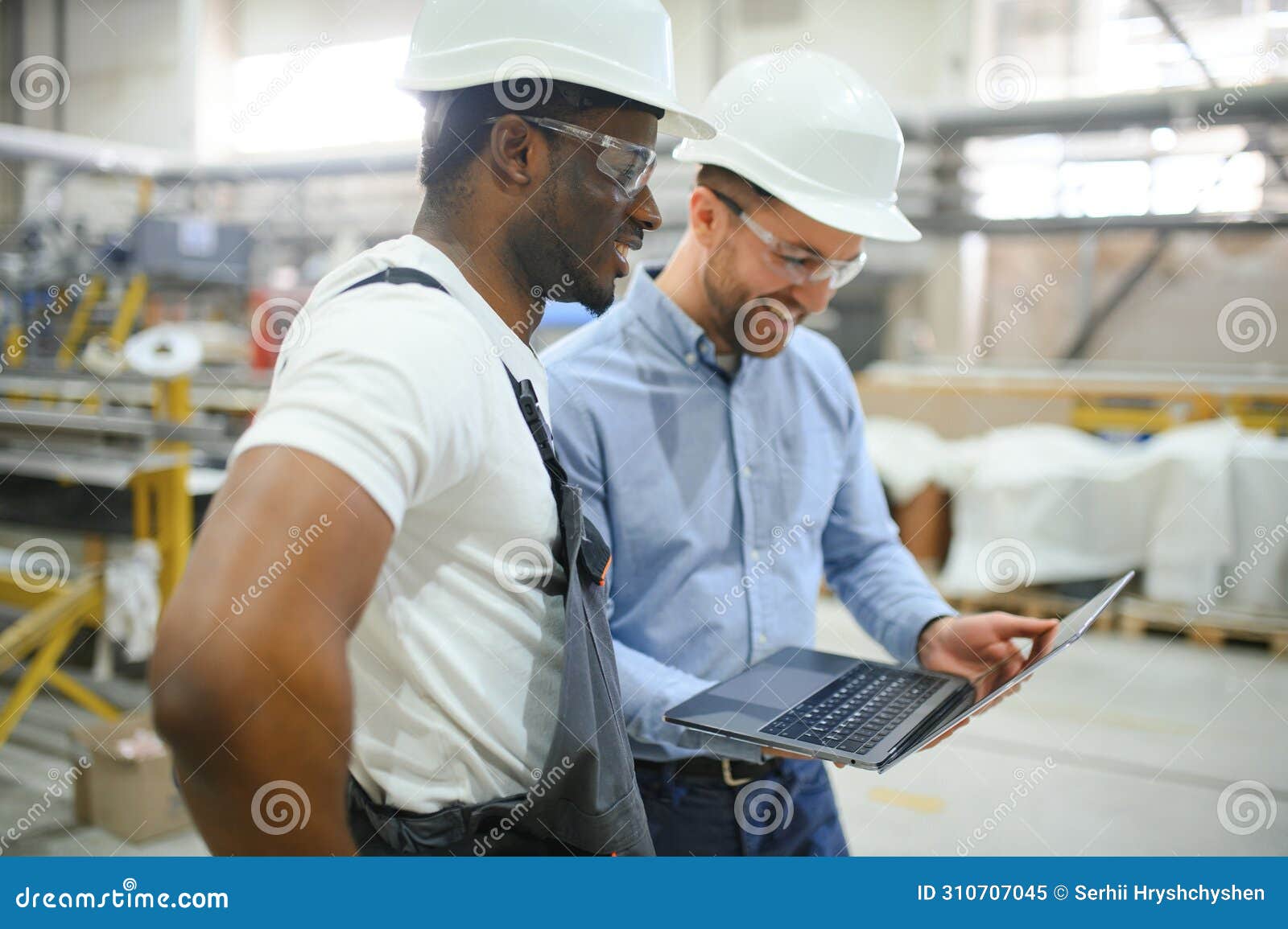 Two Workers at a Factory for the Production of Plastic Windows ...