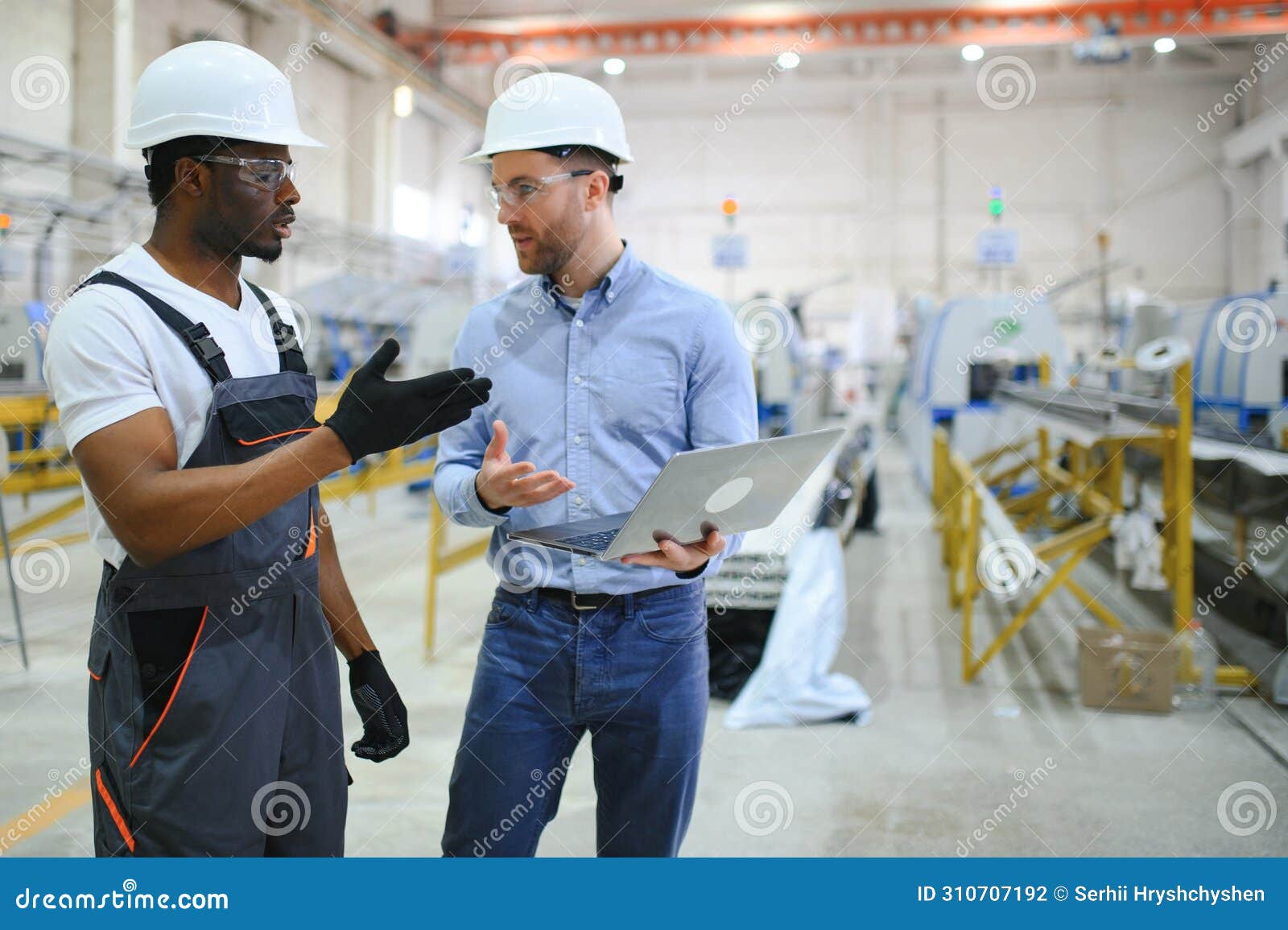 Two Workers at a Factory for the Production of Plastic Windows ...