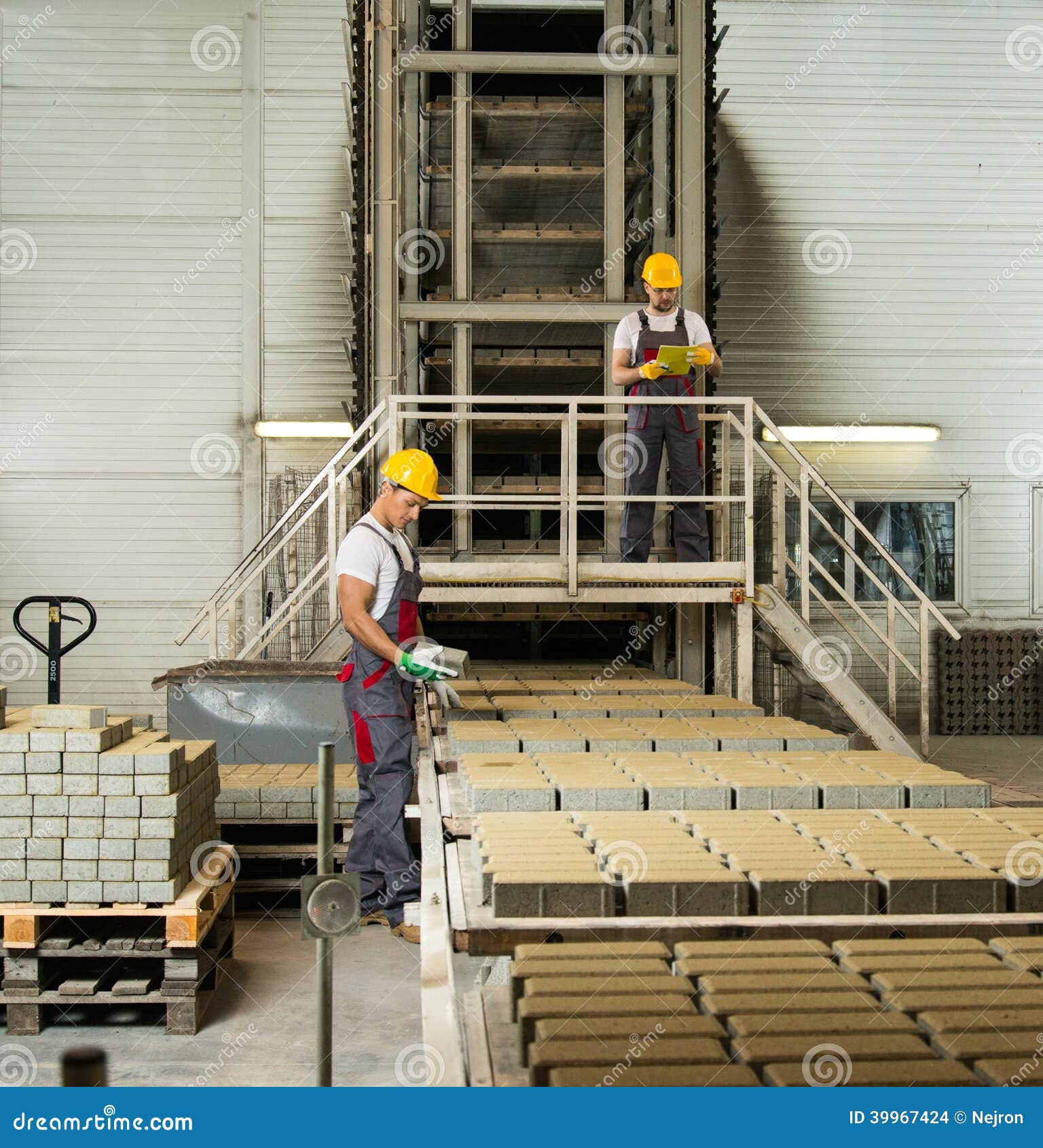 Two workers on a factory stock photo. Image of construction - 39967424