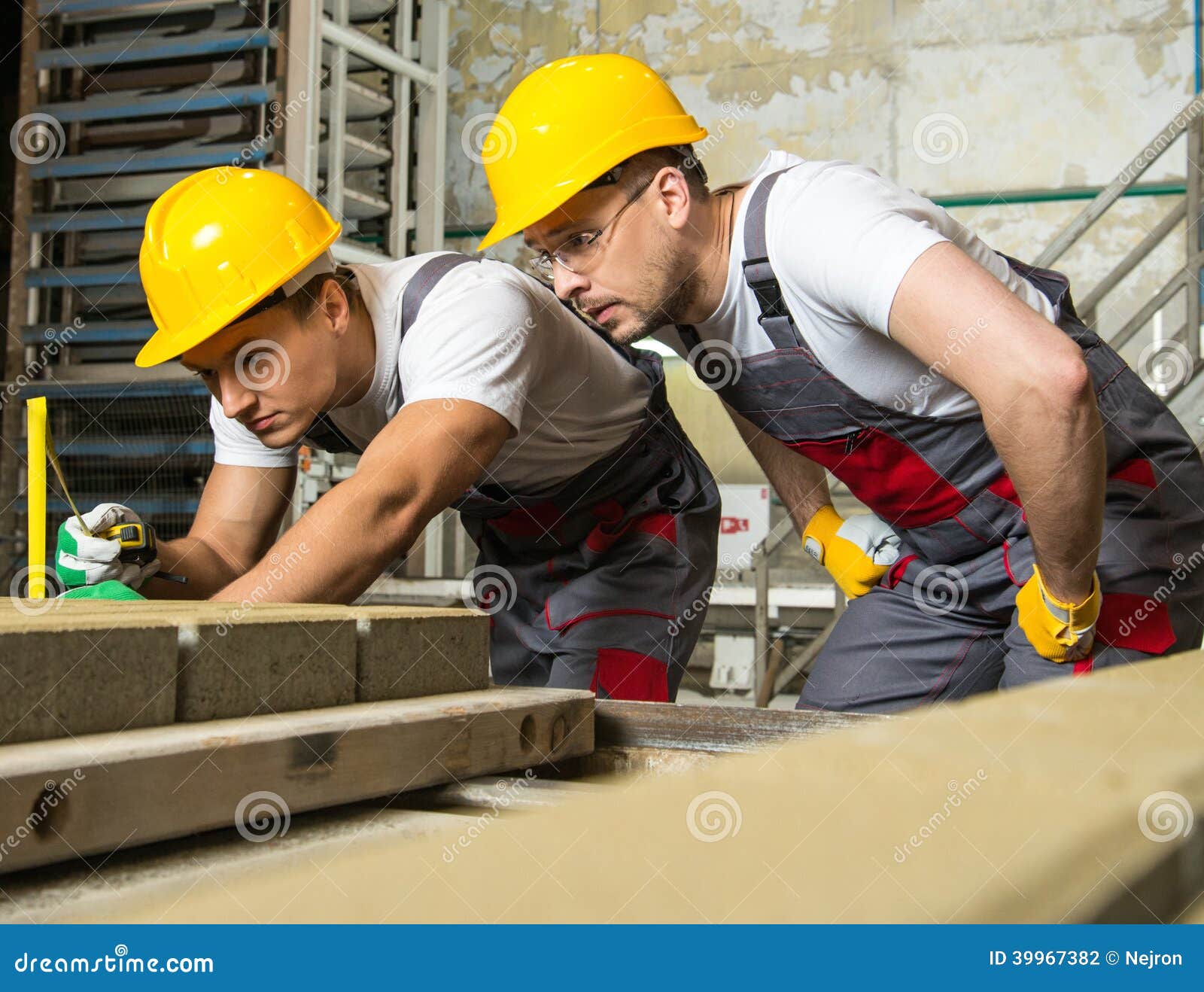 Two workers on a factory stock photo. Image of factory - 39967382