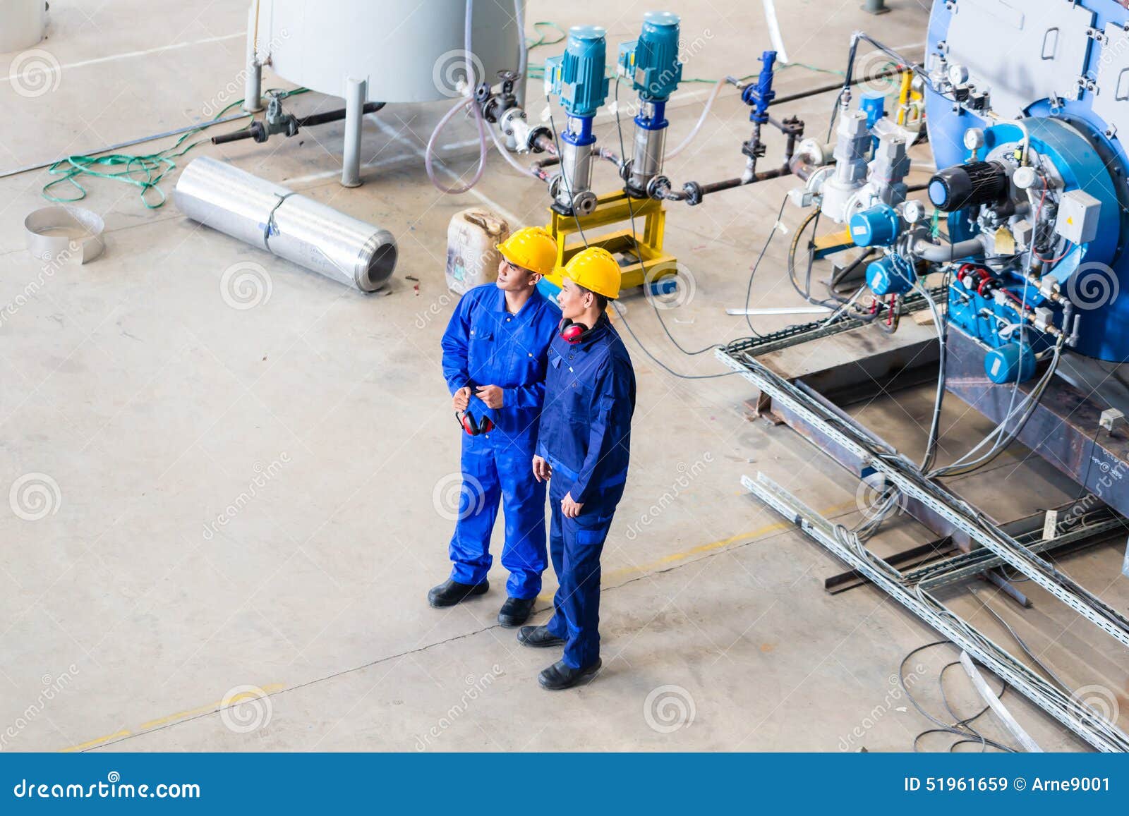 Two Workers in Industrial Factory Discussing Stock Image - Image of ...