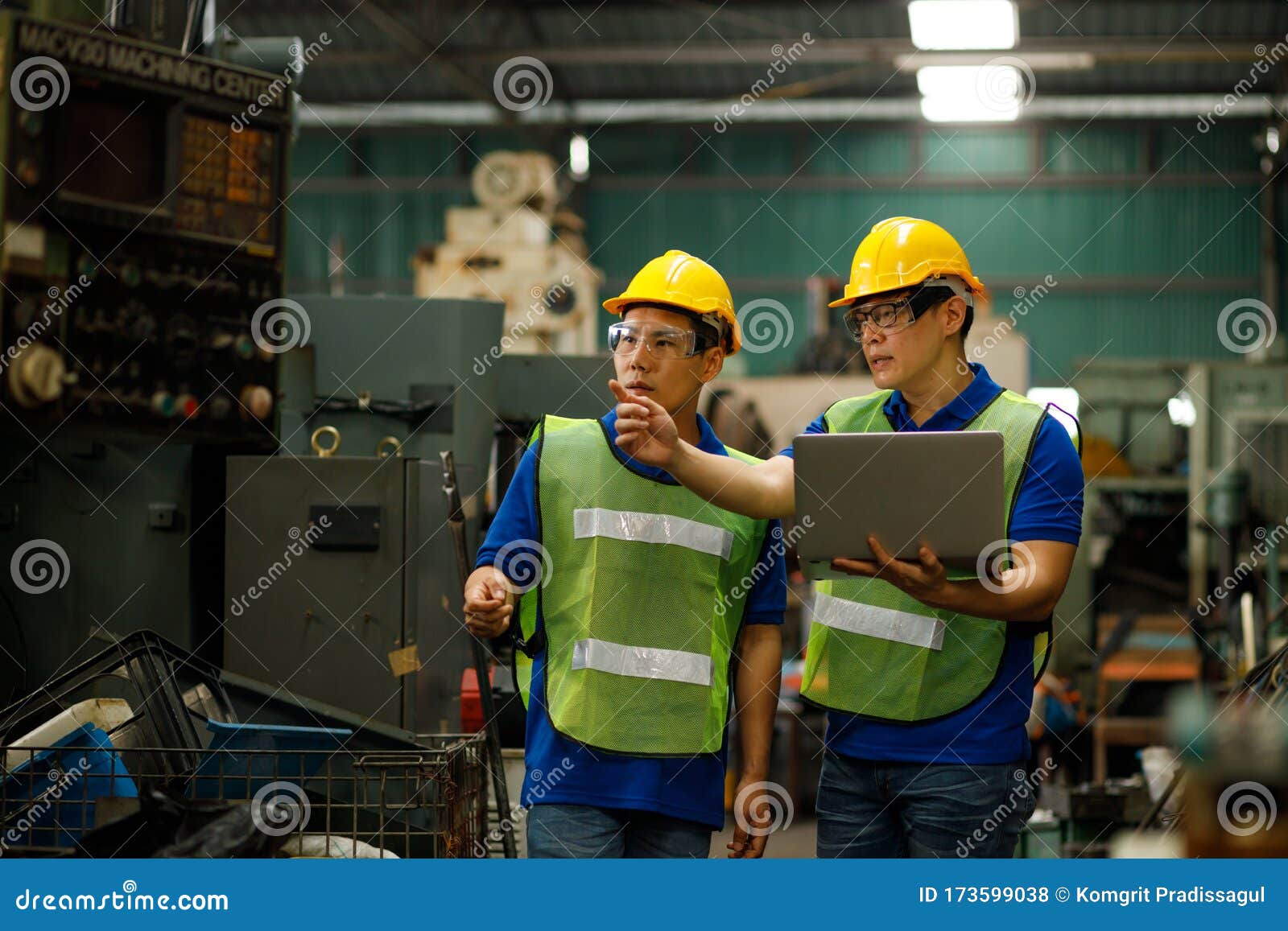 Engineer Looking of Working at Industrial Machinery Setup in Factory ...