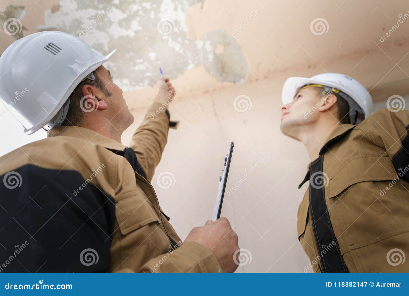 Two Workers Inspecting Building Ceiling Stock Image - Image of modern ...
