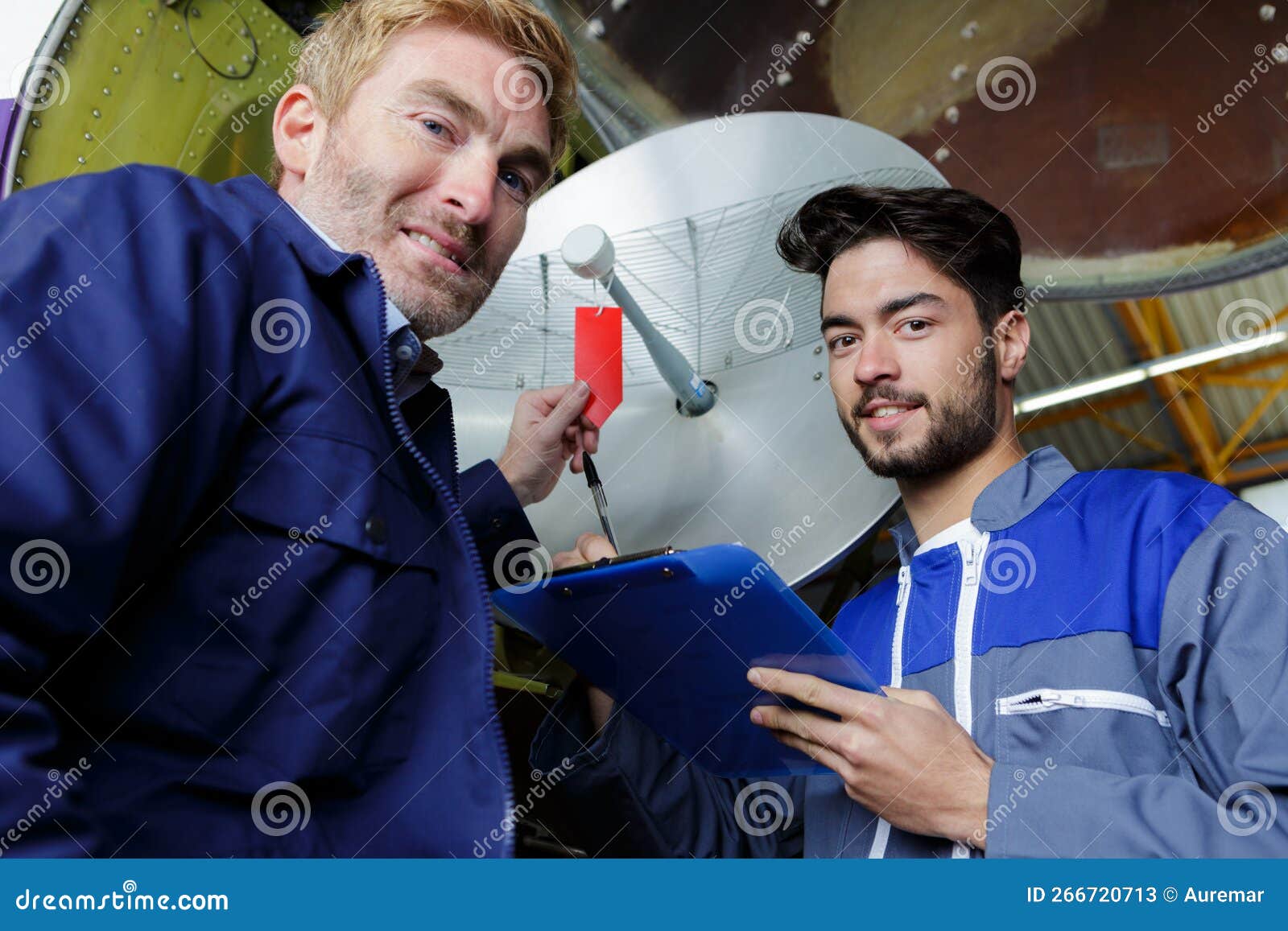 Two Workers Install Equipment at Cell Phone Tower Stock Image - Image ...