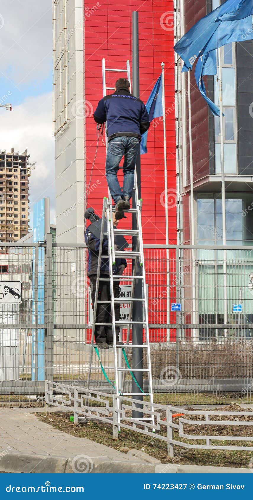 Two workers on the ladder. editorial photography. Image of work - 74223427