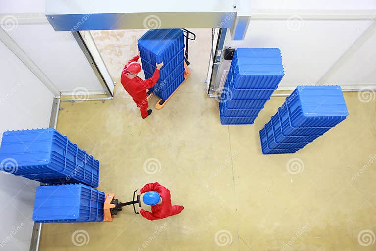 Two Workers Loading Plastic Boxes Stock Image - Image of freight ...