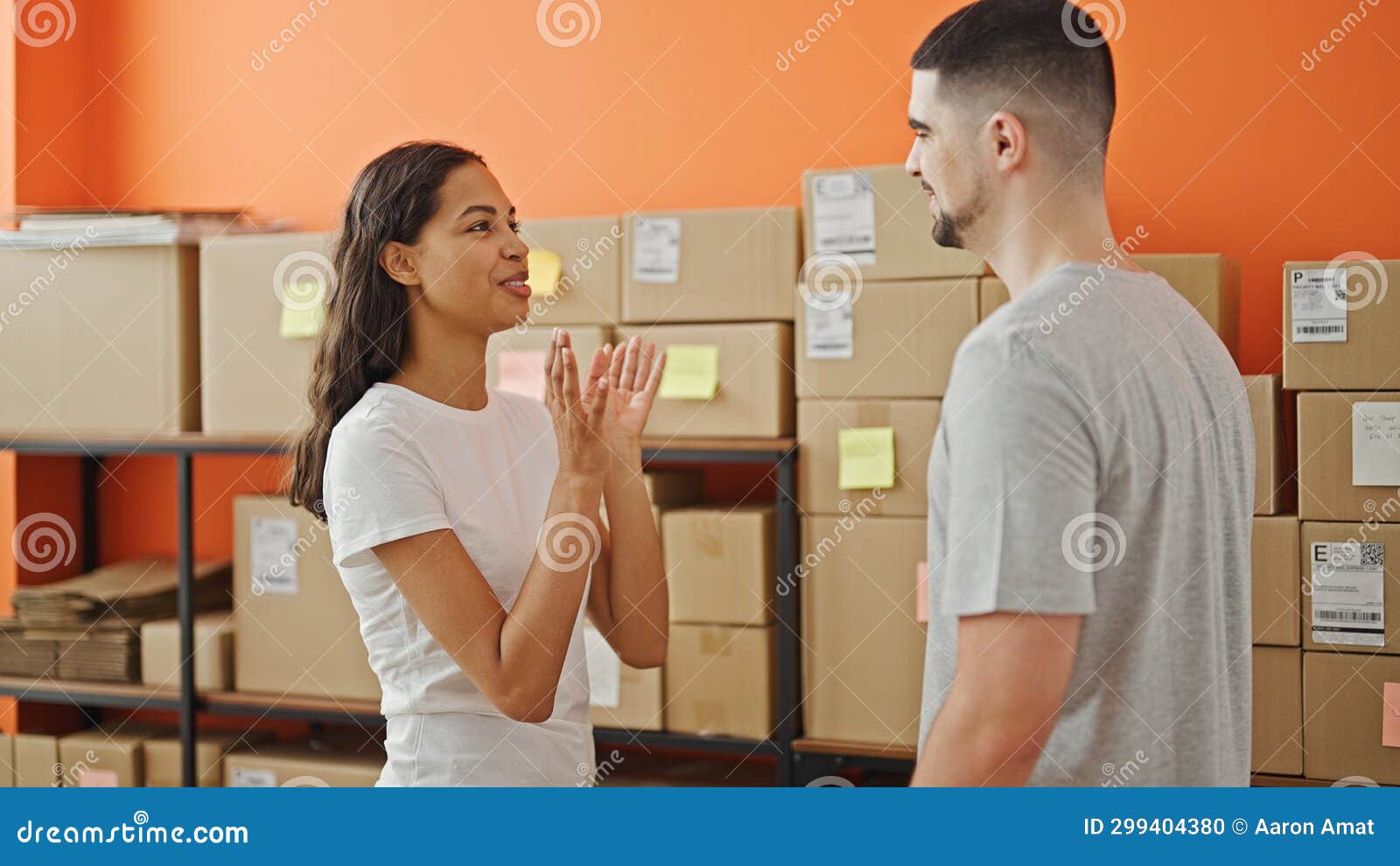 Two Workers Man and Woman Standing Together Speaking at Office Stock ...