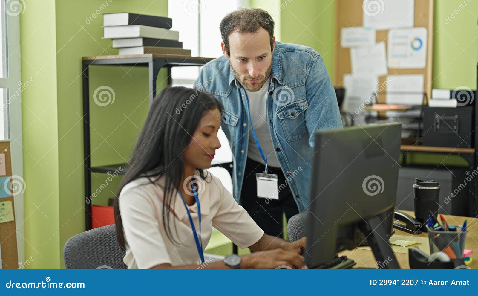 Two Workers Man and Woman Using Computer Speaking at the Office Stock ...