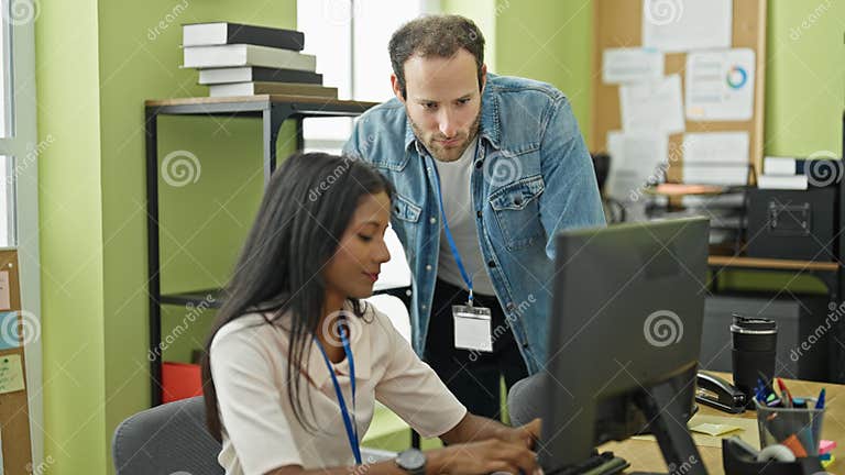 Two Workers Man and Woman Using Computer Speaking at the Office Stock ...