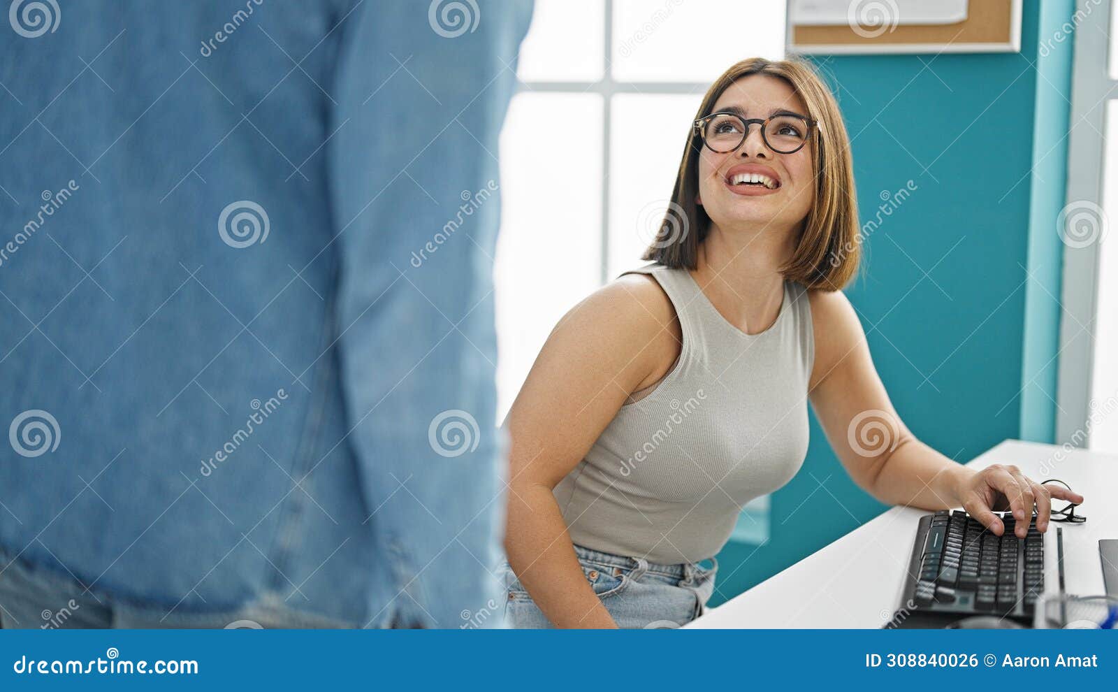 Two Workers Man and Woman Using Computer Speaking at the Office Stock ...