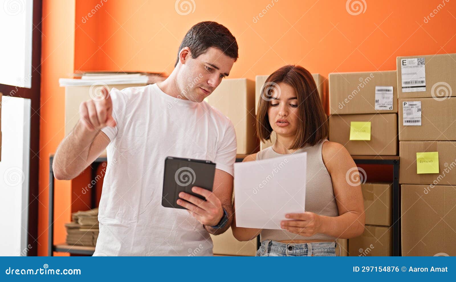 Two Workers Man and Woman Using Touchpad Checking Packages at Office ...