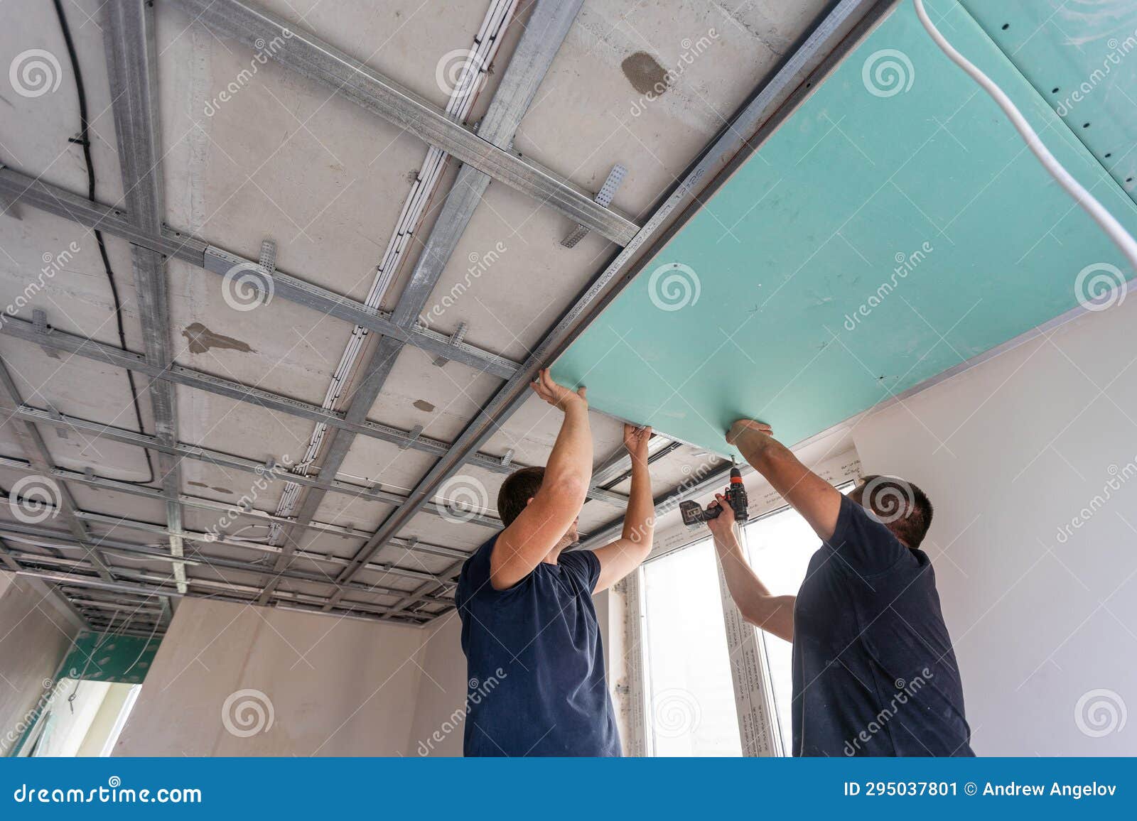 Two Workers are Mounted Ceiling in the New Flat Stock Image - Image of ...