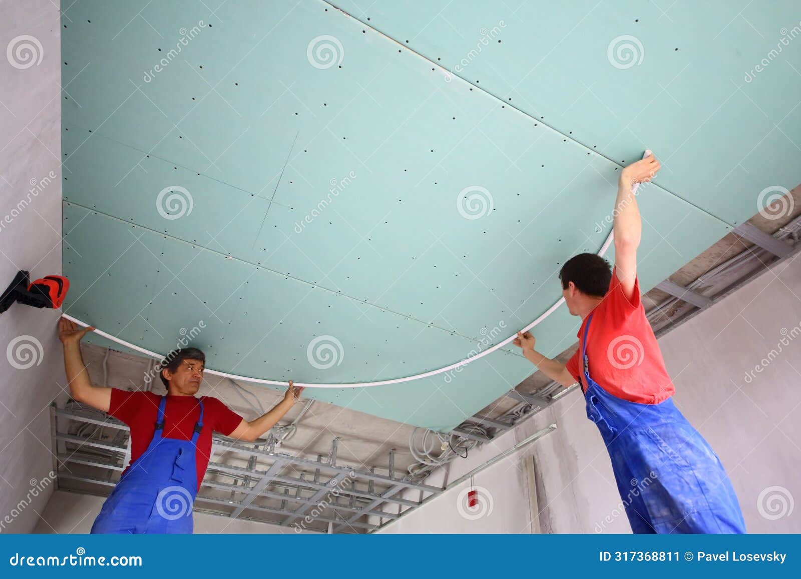 Two Workers are Mounted Ceiling in the New Stock Image - Image of ...