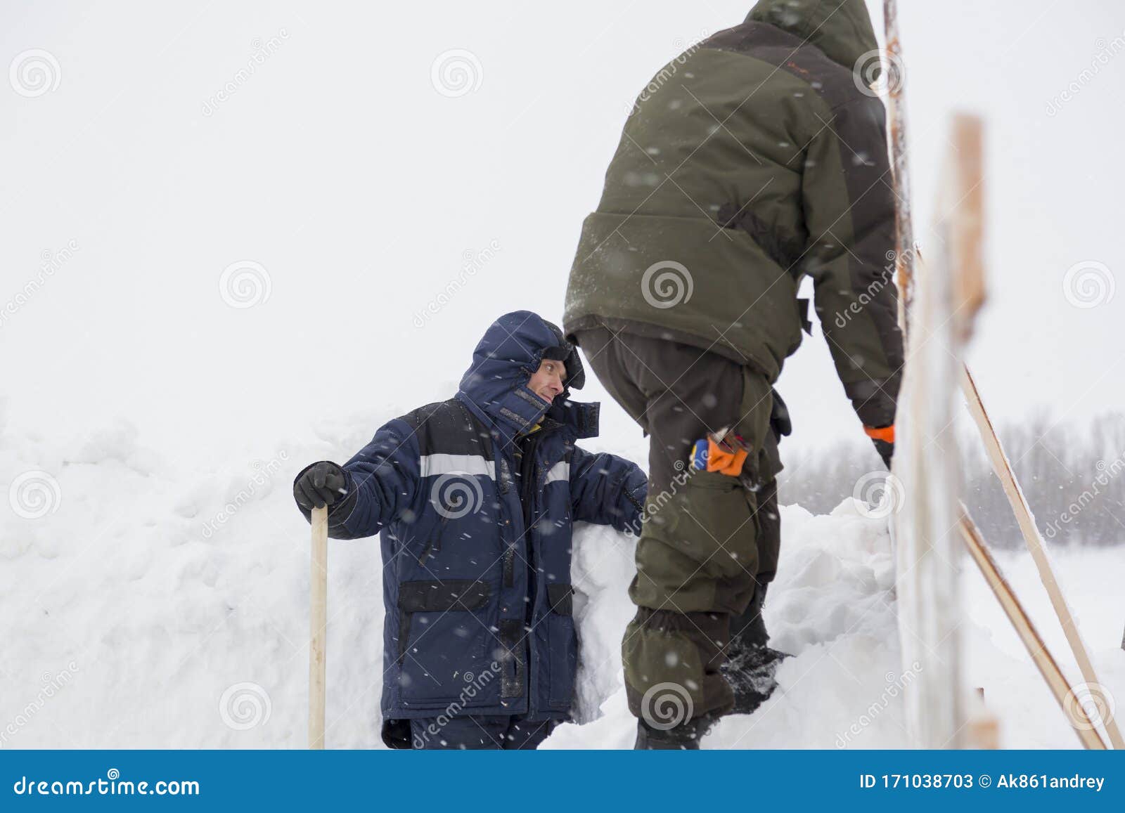 Two Workers in Overalls at a Construction Site Stock Image - Image of ...
