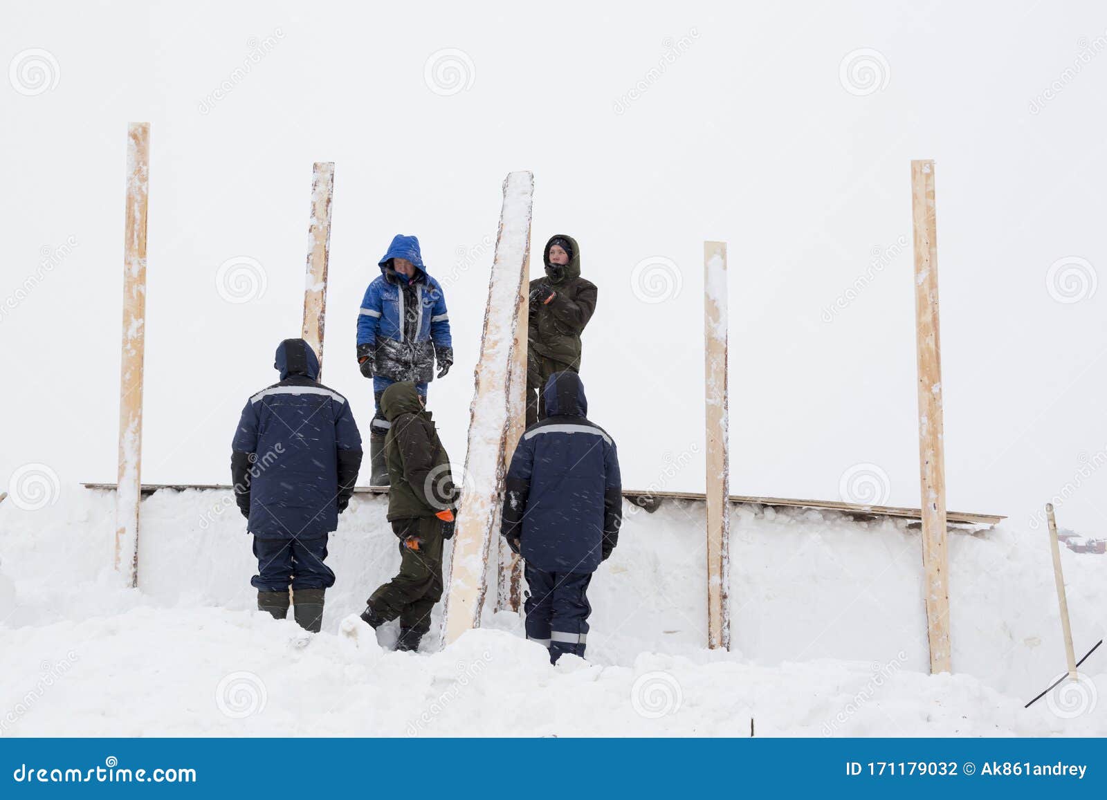 Two Workers in Overalls at a Construction Site Stock Photo - Image of ...