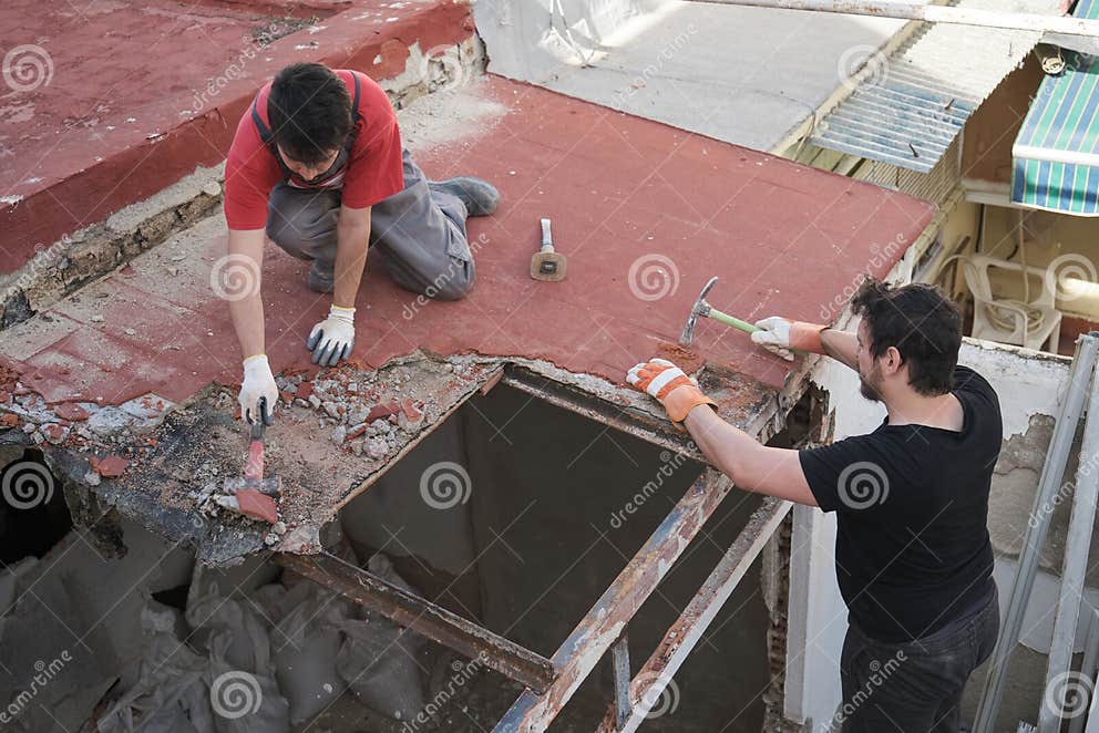 Two Workers Pulling Apart the Ceiling of a House Down. Stock Image ...