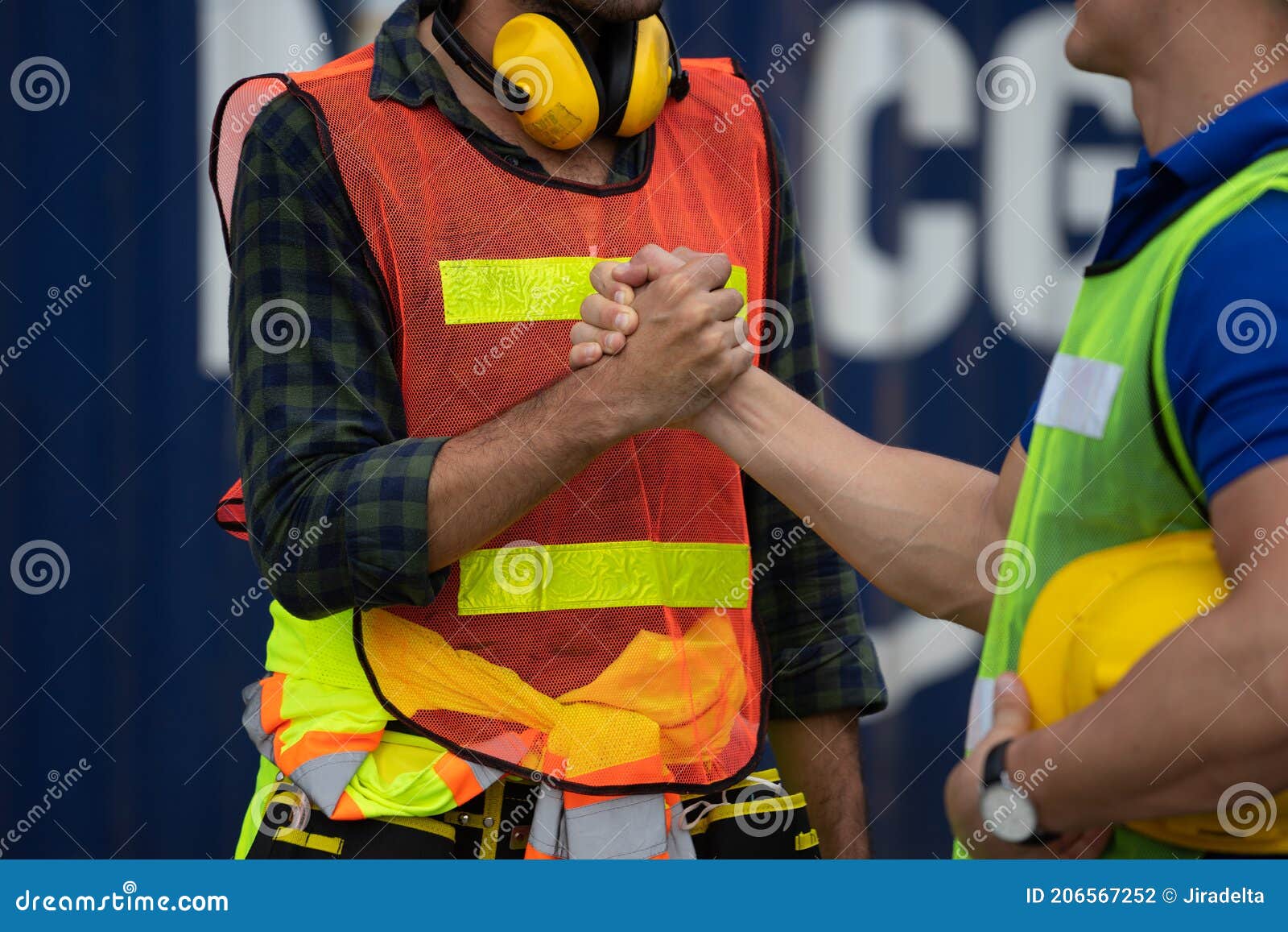 Two Workers in Safety Vest Reflective Hands Shake Stock Photo - Image ...