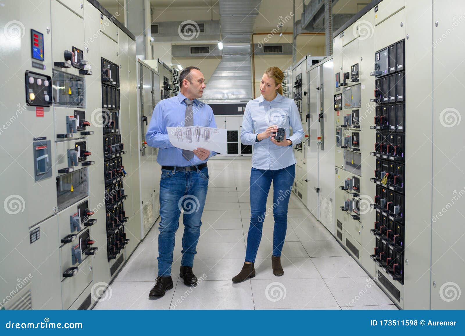 Two workers in server room stock photo. Image of examining - 173511598