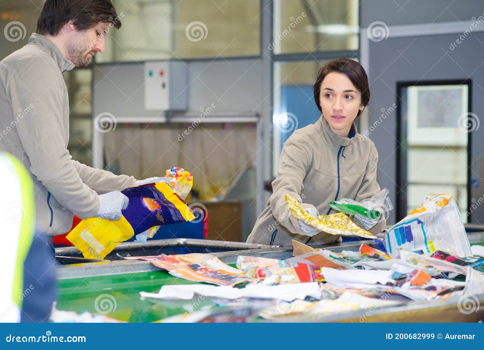 Two Workers Sorting through Recyclable Waste on Moving Belt Stock Image ...