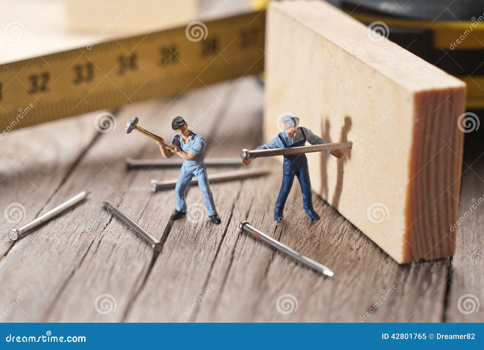 Two Workers Sticks Nail. the Concept of Teamwork Stock Image - Image of ...