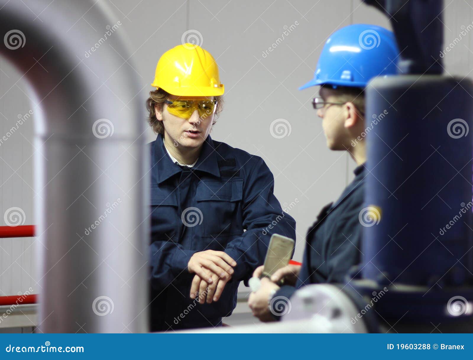 Two workers talking stock photo. Image of operation, machinist - 19603288