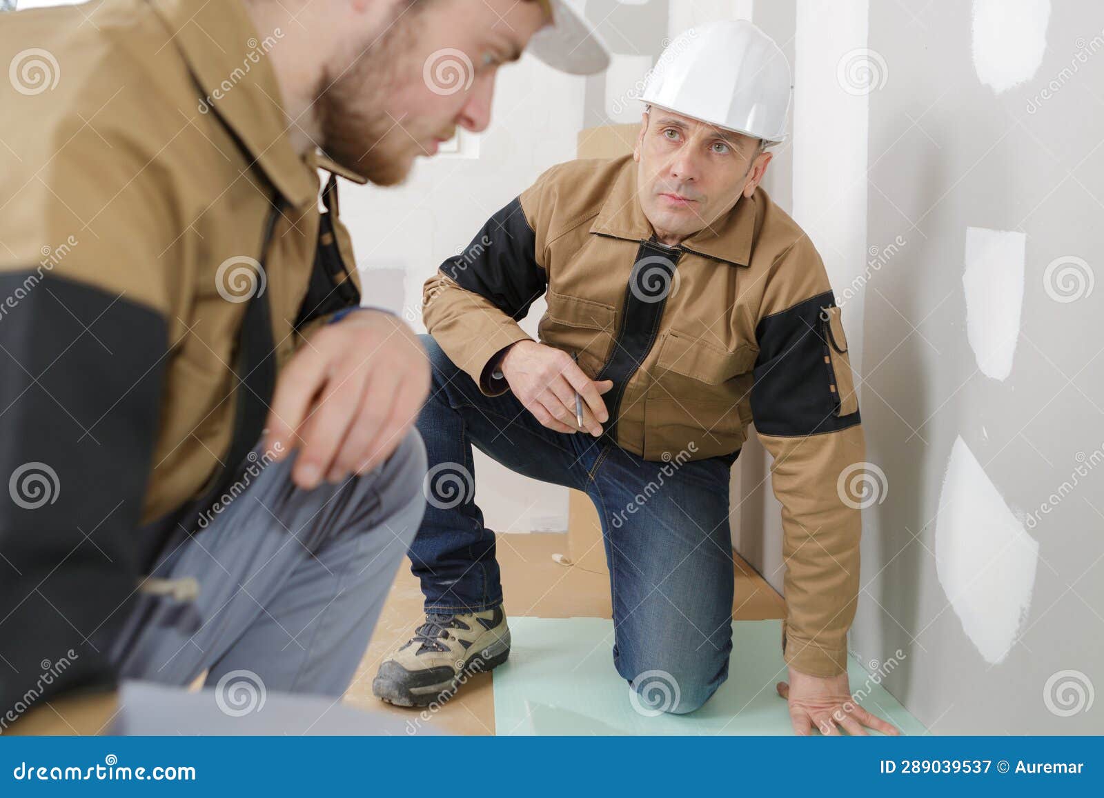 Two Workers Talking about Construction Technique Stock Image - Image of ...