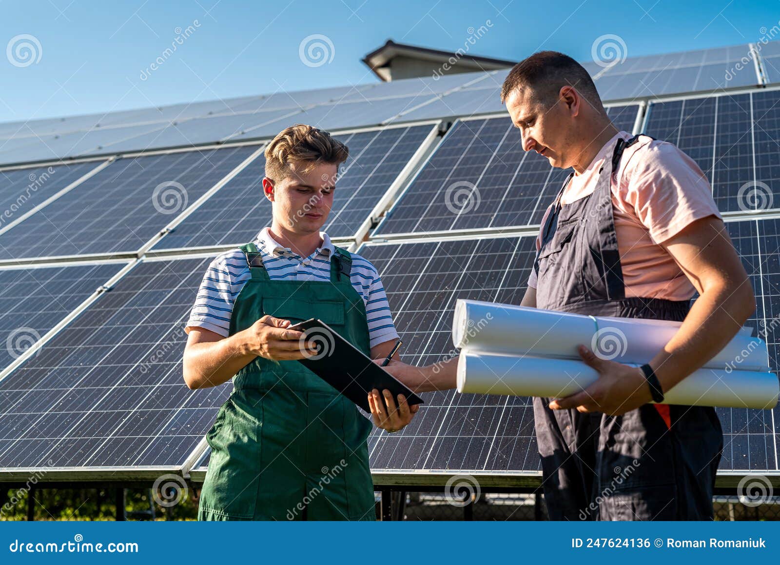Two Workers in a Uniform Talk about Installation Solar Panel ...