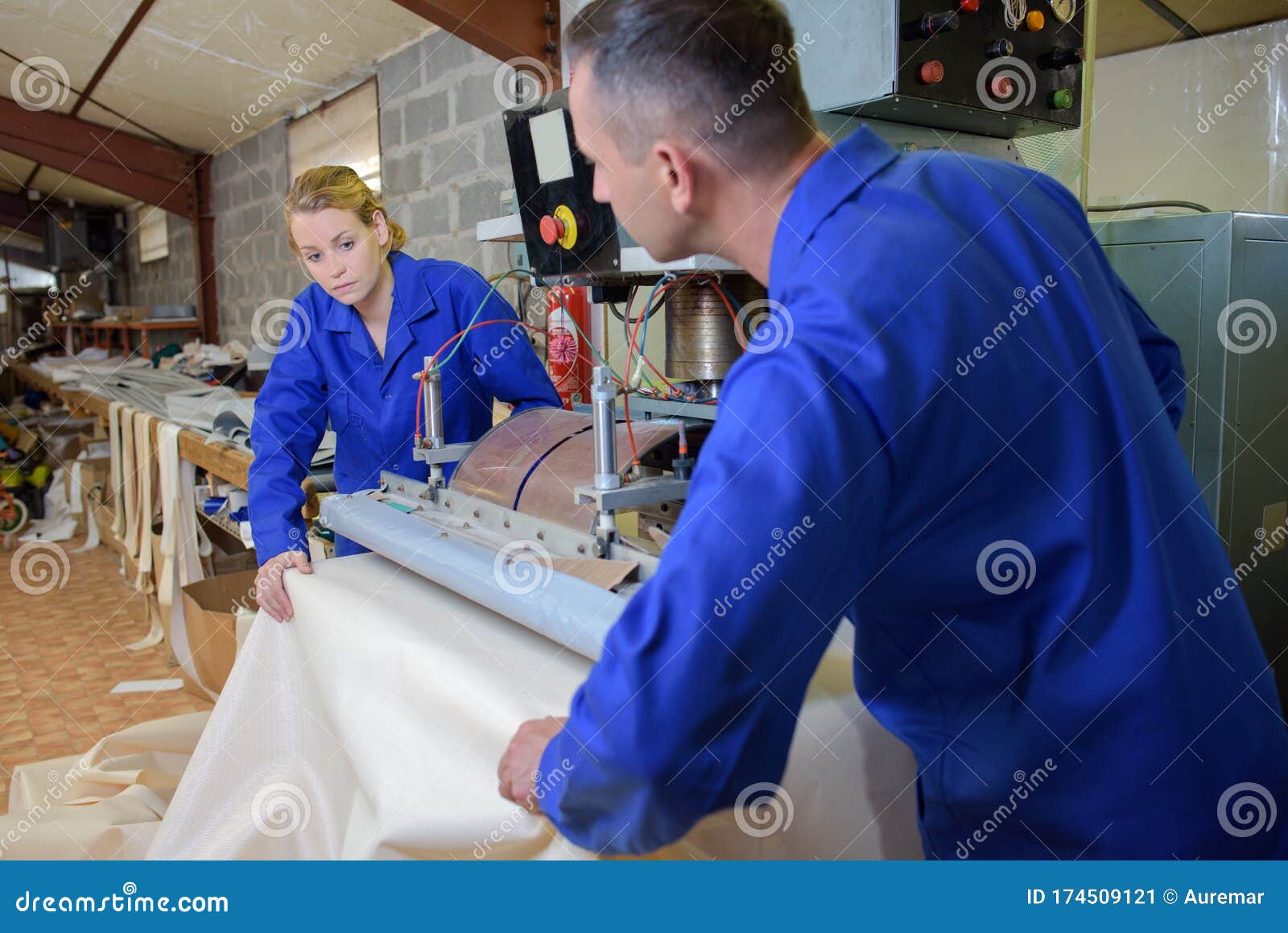 Two Workers Unrolling Material Stock Image - Image of work, worker ...