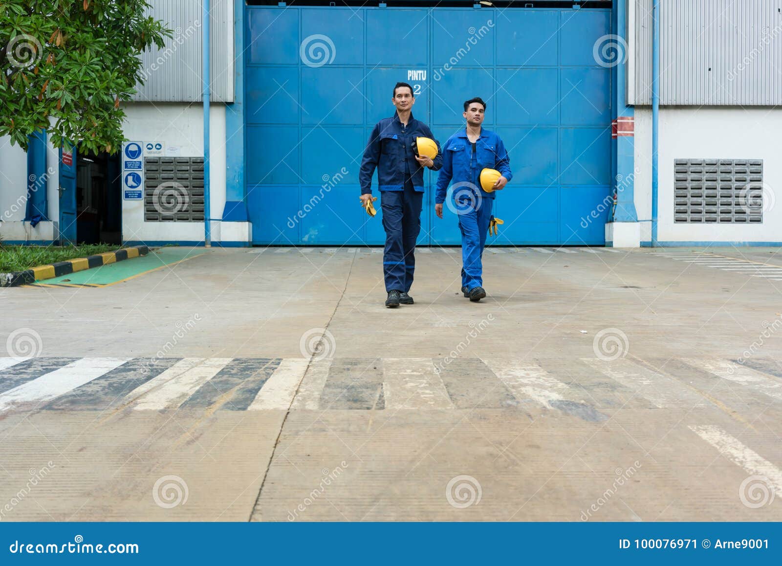 Two Workers Walking Out from Factory after Work Stock Image - Image of ...
