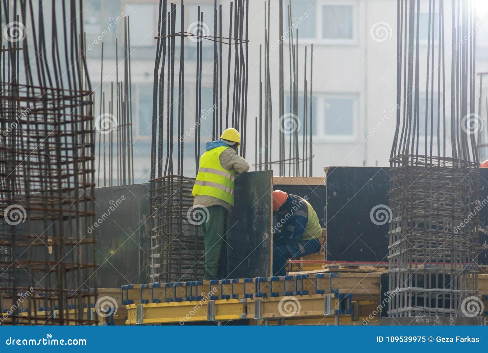 Two Labours Work on Reinforcement Bar at the Construction Site ...
