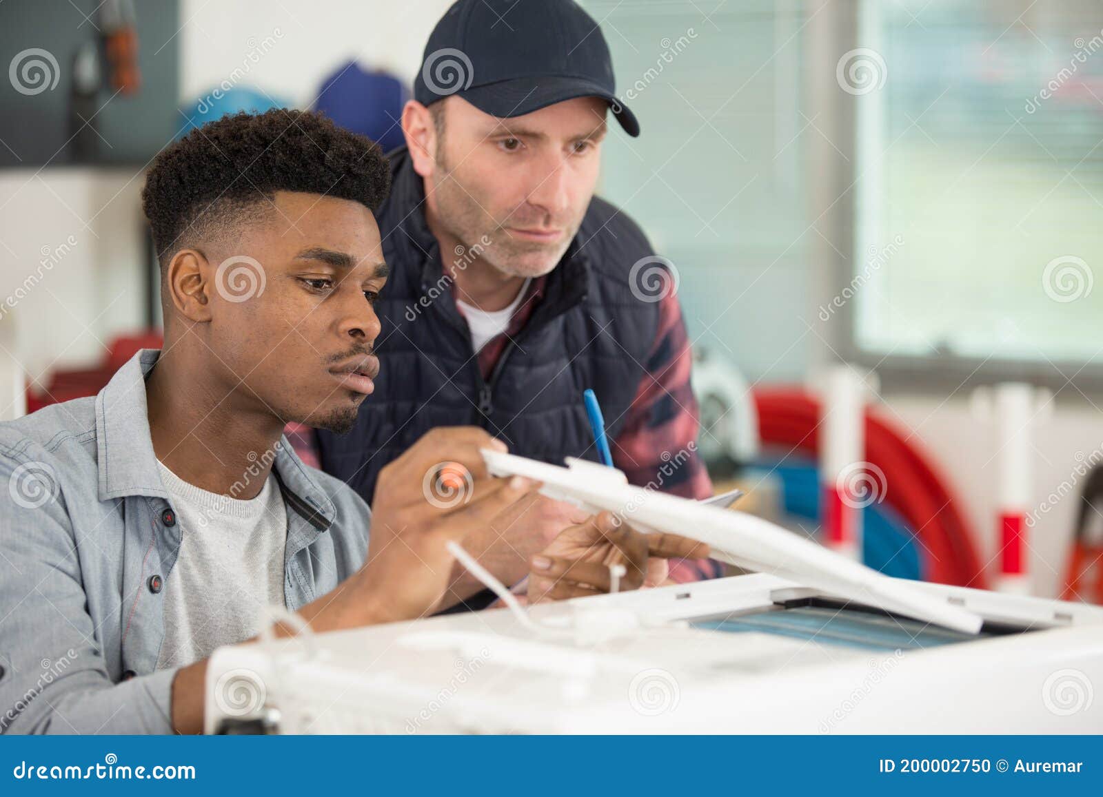 Two Workers Working on Air Conditioning Unit Stock Photo - Image of ...