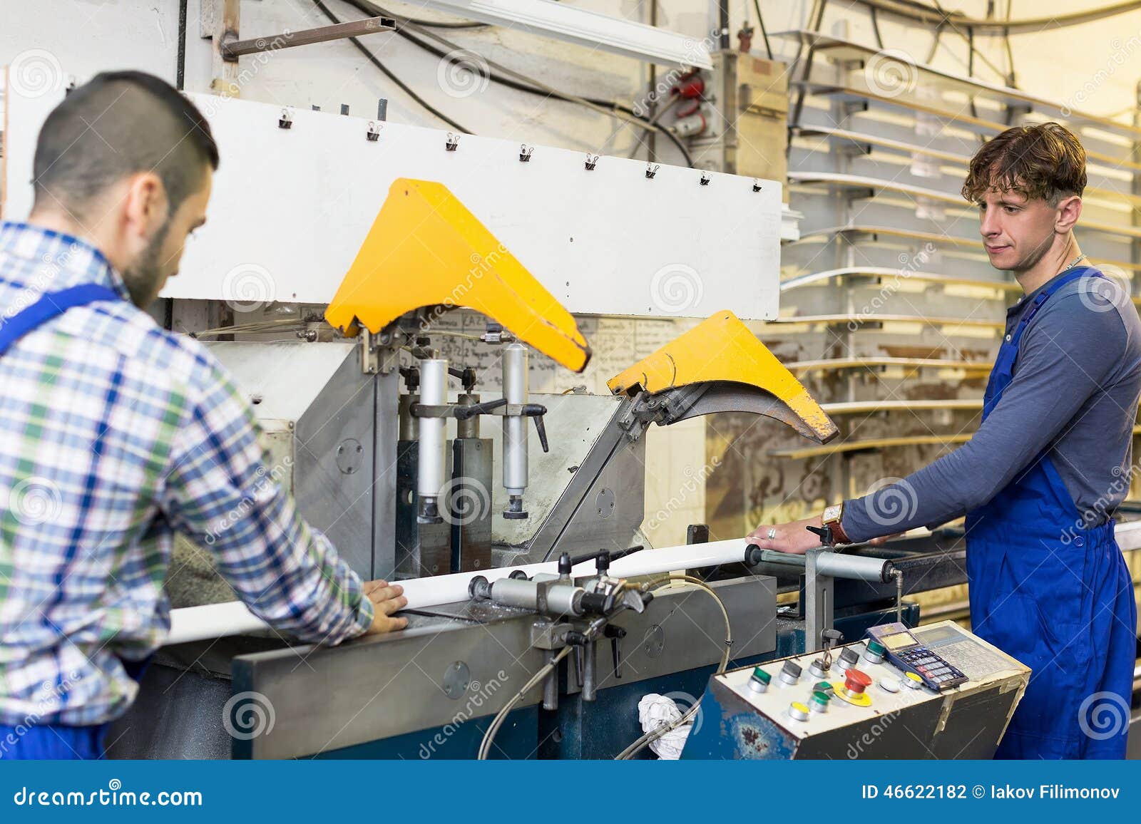 Two Workers Working on a Machine Stock Photo - Image of brigade ...