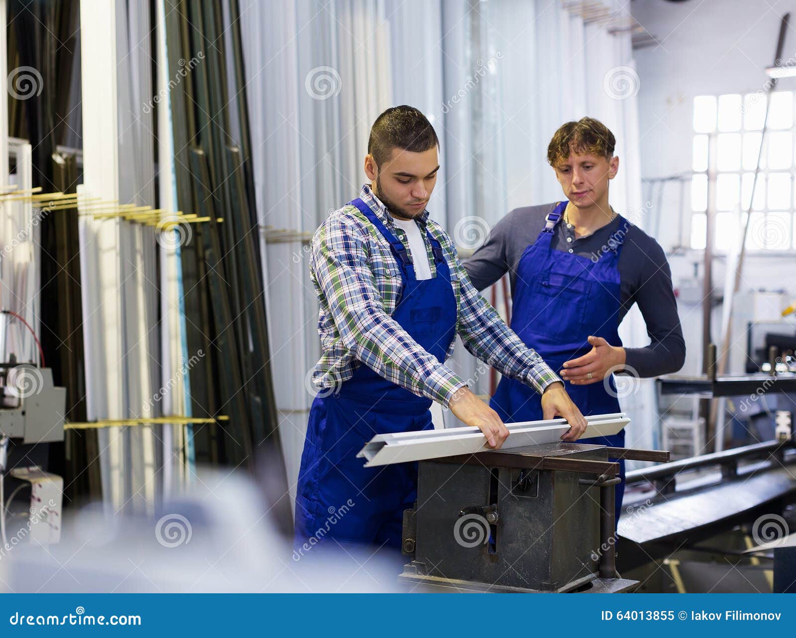 Two Workers Working on a Machine Stock Image - Image of depository ...