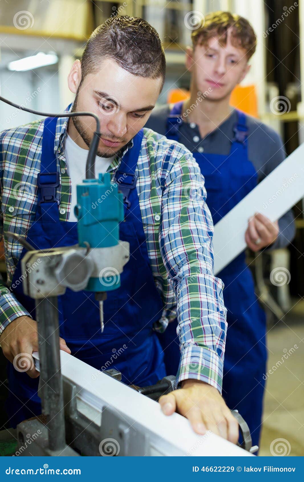 Two Workers Working on a Machine Stock Image - Image of factory, people ...